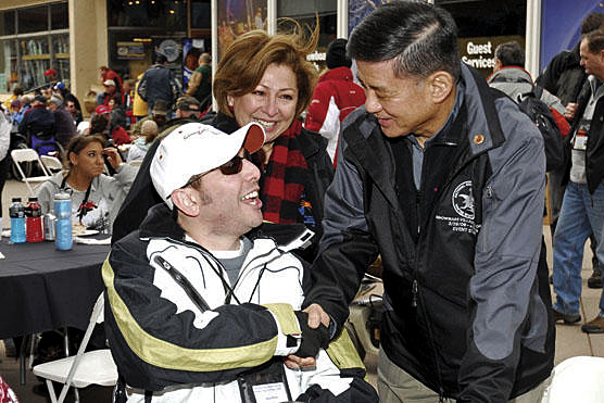 Veterans Affairs Secretary Eric K. Shinseki, right, greets Alan Babin ...