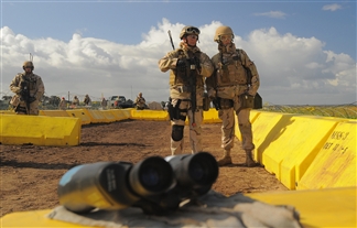 U.S. Navy sailors provide security watch for an entry control point.