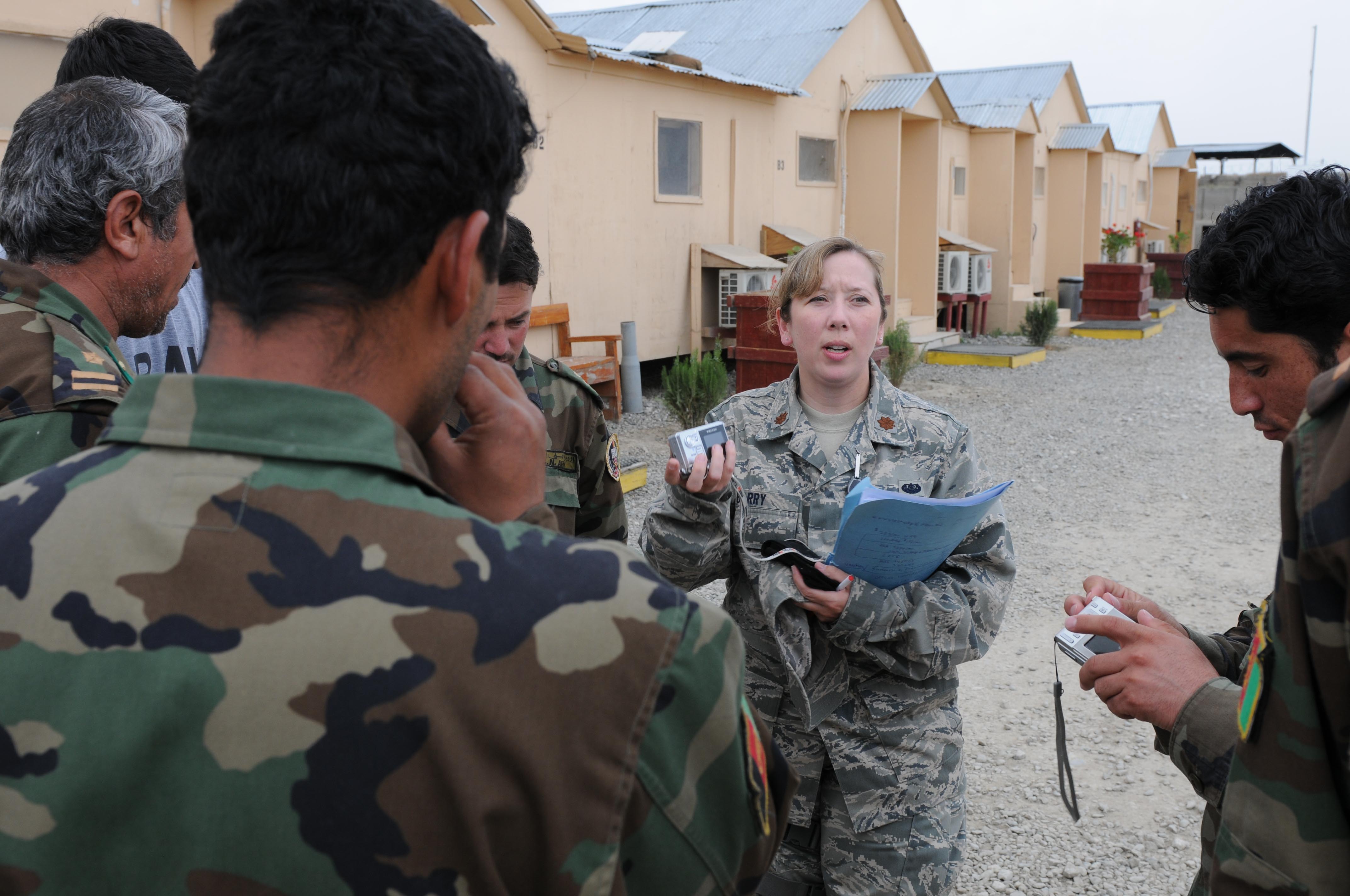 Air Force Maj. Christy Barry, a lawyer, speaks Dari with Afghan army ...