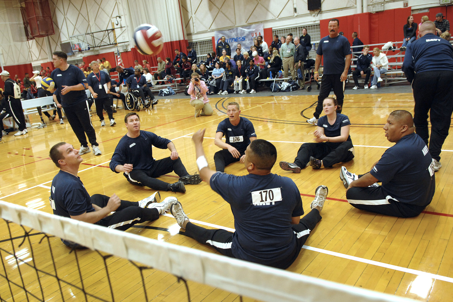 The U.S. Navy sitting volleyball team warms up for a match at the U.S ...