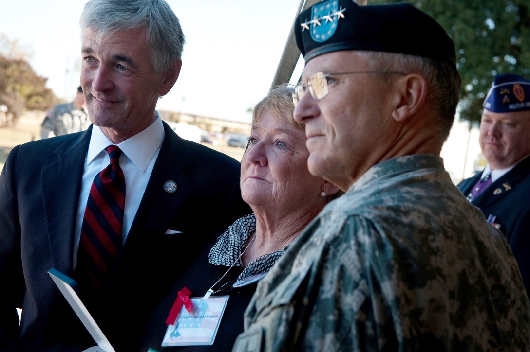Christine Gaffaney, center, widow of Army Capt. John Gaffaney, poses ...
