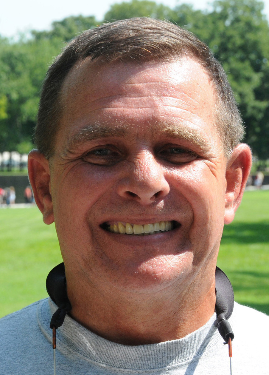 Michael Tripp, a Vietnam veteran, poses for a photo at the Vietnam Veterans Memorial in ...