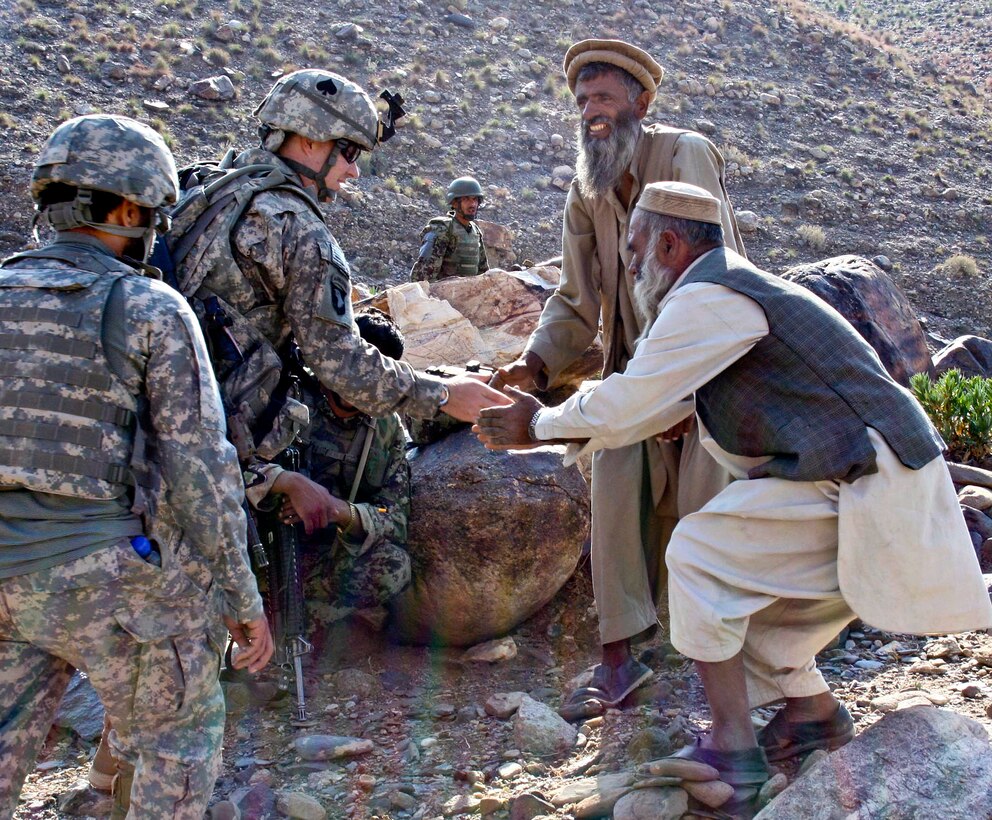 Gurem Village elders greet U.S. Army 2nd Lt. Daniel Wild, second from ...
