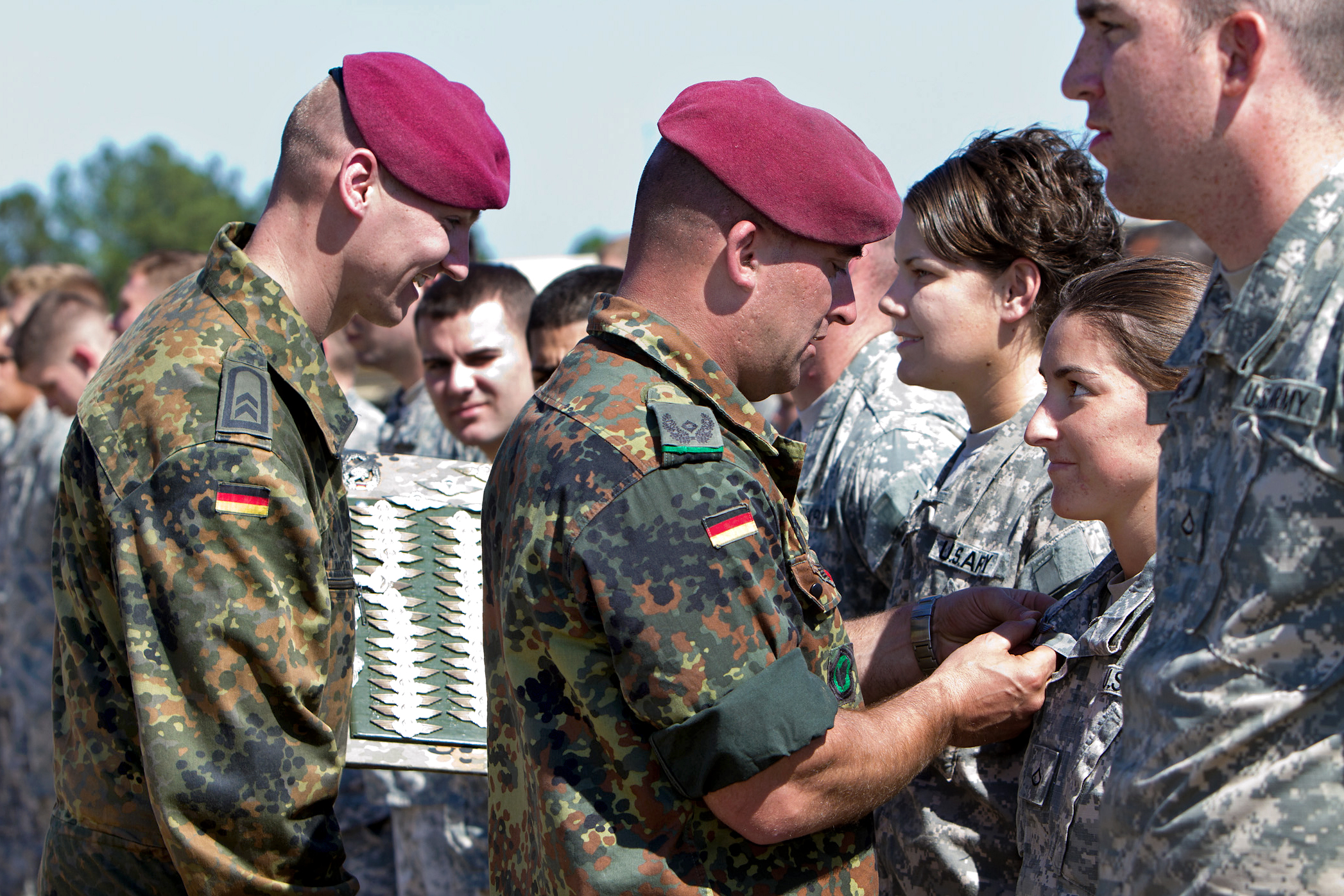 German Maj. Falk Oberdorf pins German jump wings on a U.S. Army ...