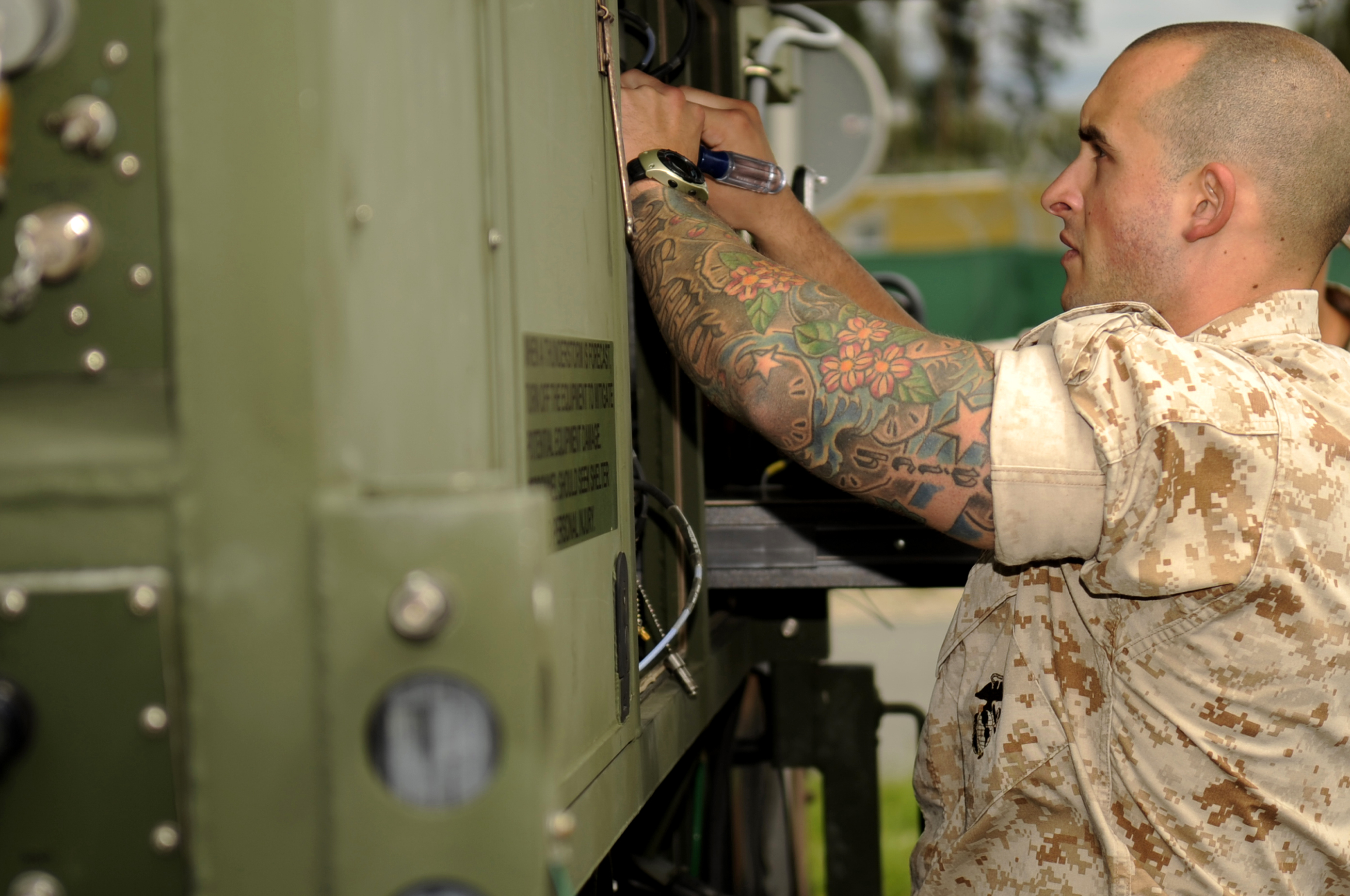 U.S. Marine Corps Sgt. Ryan Halcovich sets up a Phoenix Satellite ...