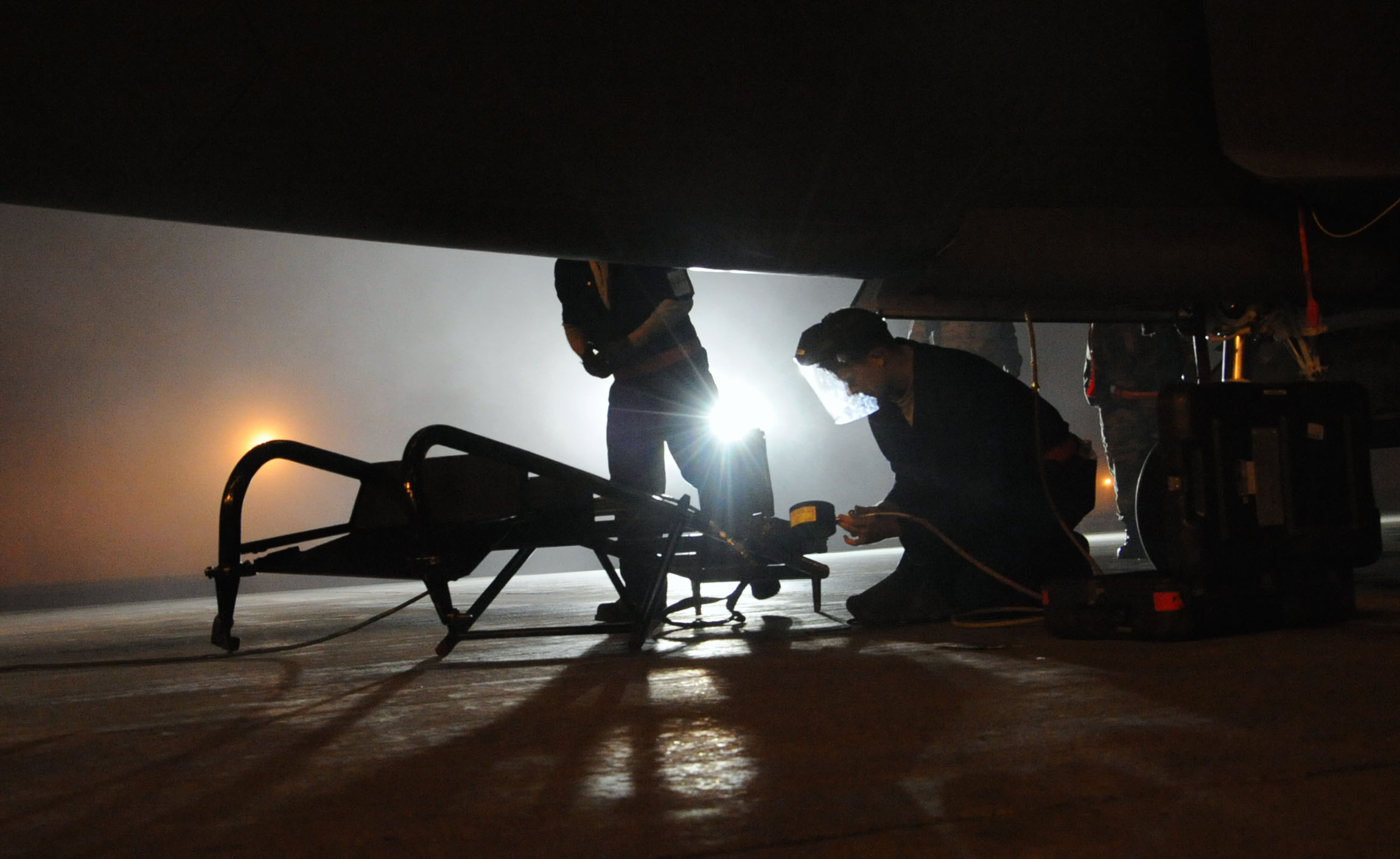 90th AMU Crew Chiefs Perform maintenance at night