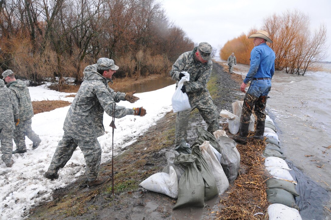 U.S. Army Spcs. Eric Wiederholt, left, and Joshua Peterson pass ...