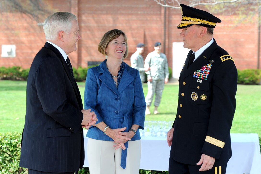 Army Gen. Martin E. Dempsey, right, and his wife, Deanie, share a laugh ...