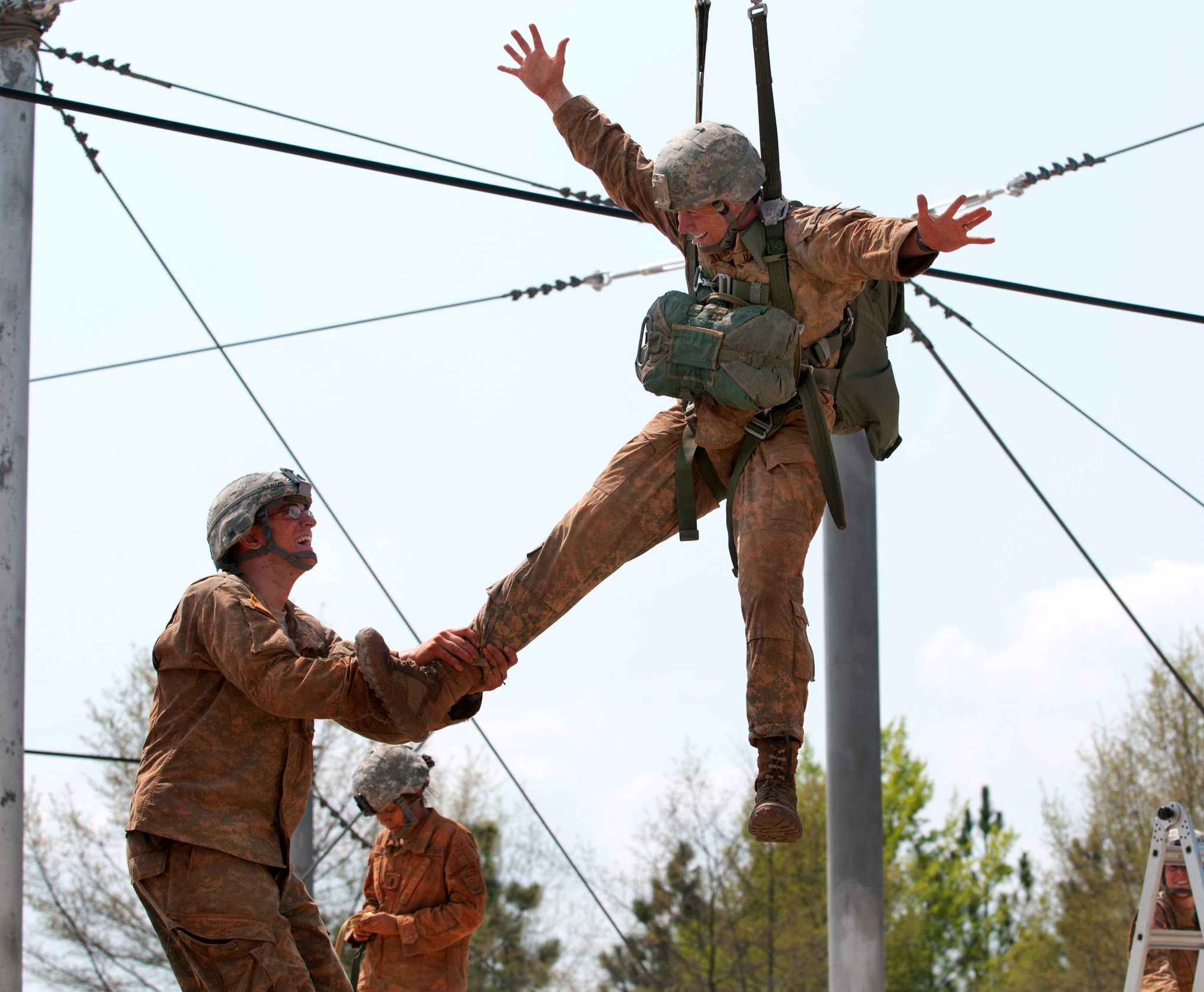 A U.S. Army paratrooper training on a 40-foot-high training tower at ...