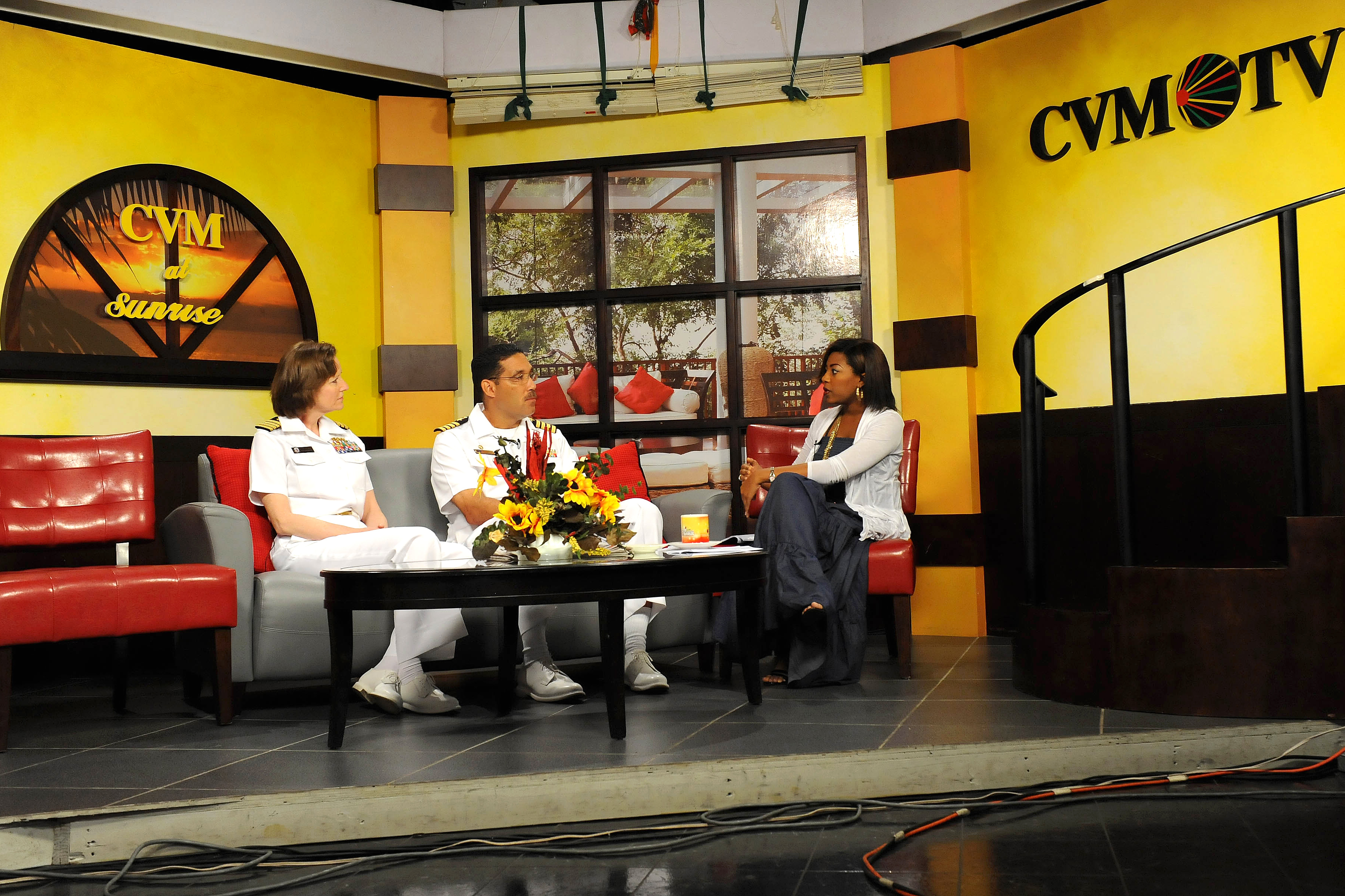 U.S. Navy Capt. Brian Nickerson, center, Continuing Promise's commodore ...