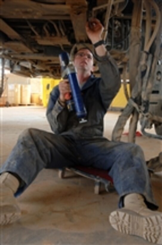 Staff Sgt. Todd Hickman greases the joints on a 60K cargo loader. | U.S ...