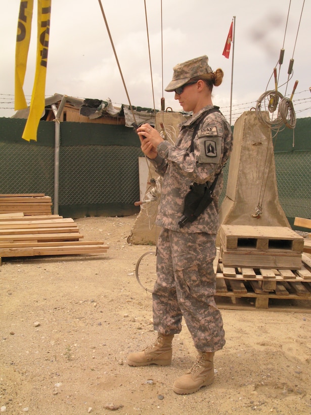 Army Pfc. Audrey Triplett adjusts cables to a 107-foot Rapid Aerostat ...