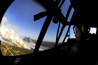 Lt. Col. Greg Ervin surveys the Oasis wildfire as they prepare to ...