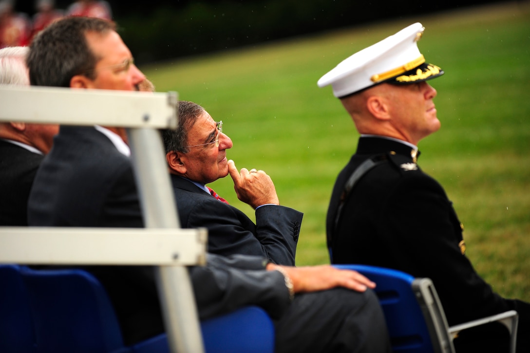 Defense Secretary Leon E. Panetta, center, listens to final remarks ...