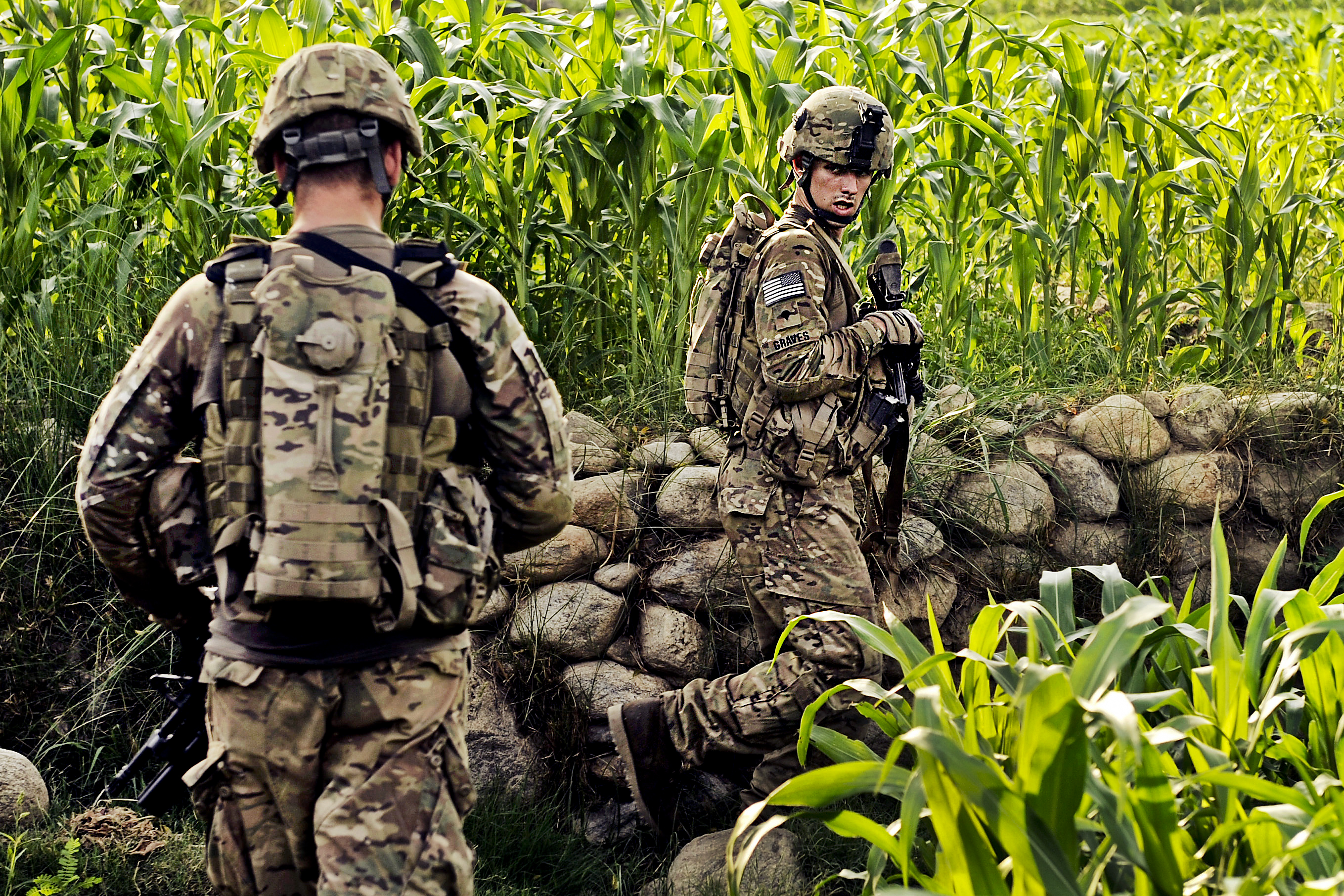 U.S. Army Spcs. Kyle Graves, right, and Michael Bartolo navigate ...