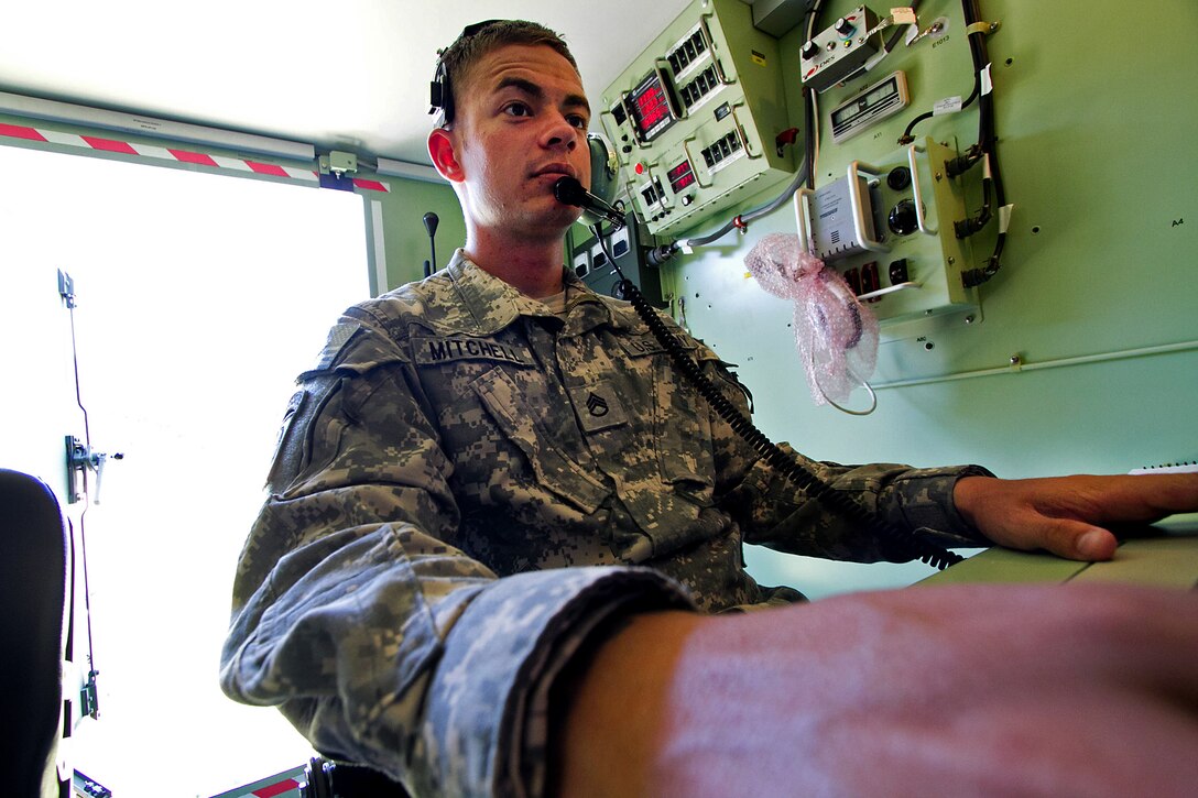 Army Staff Sgt. Christopher Mitchell prepares for a training flight on ...