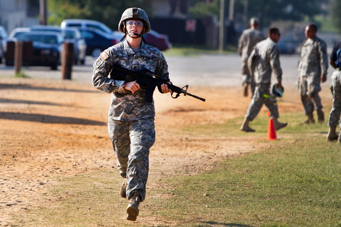 Army Staff Sgt. Bethany Moser completes a 400-meter run, the first part ...