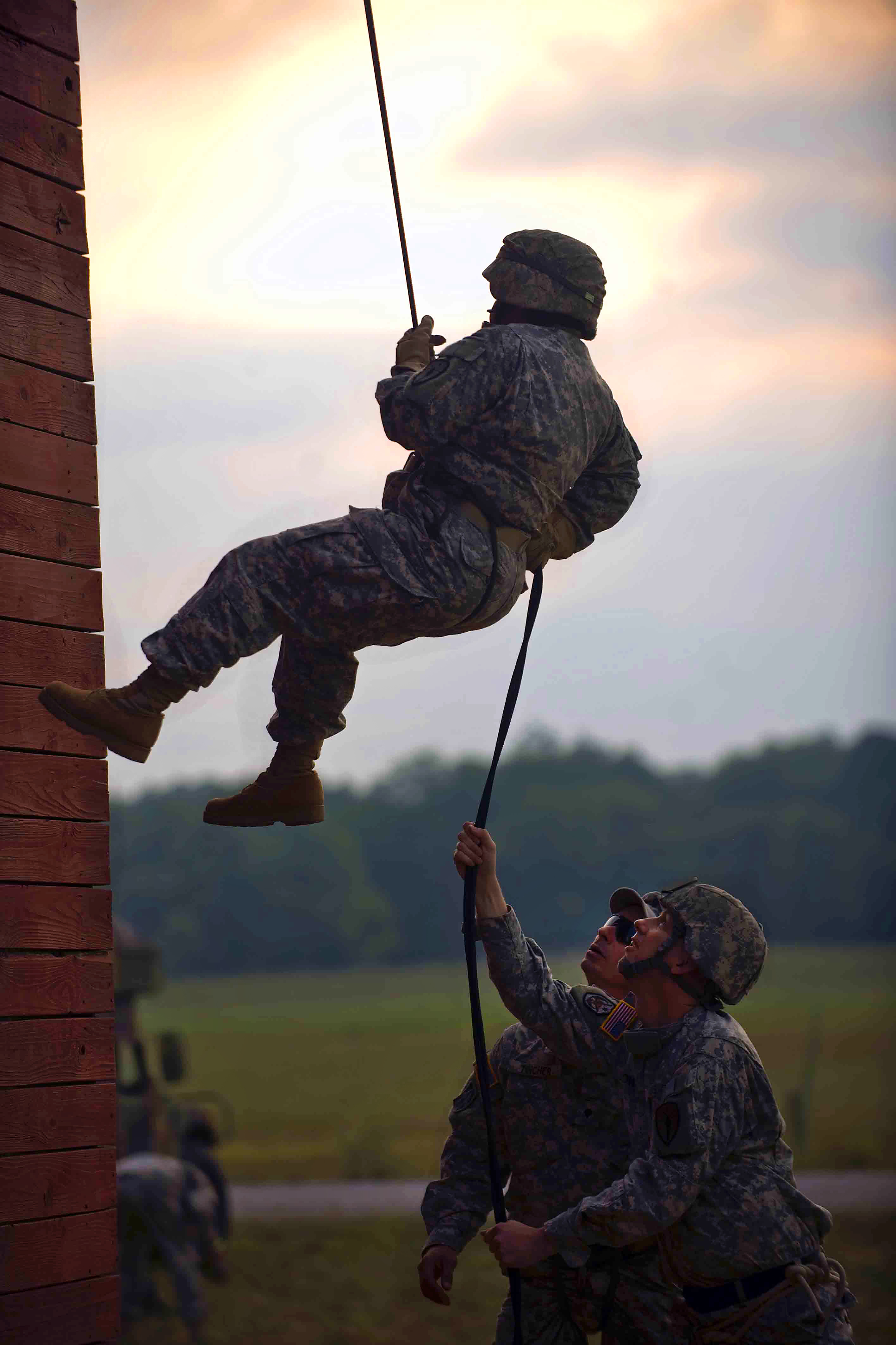 Army Sgt. Lasima Packett rappels down the rappel tower at the Joint ...