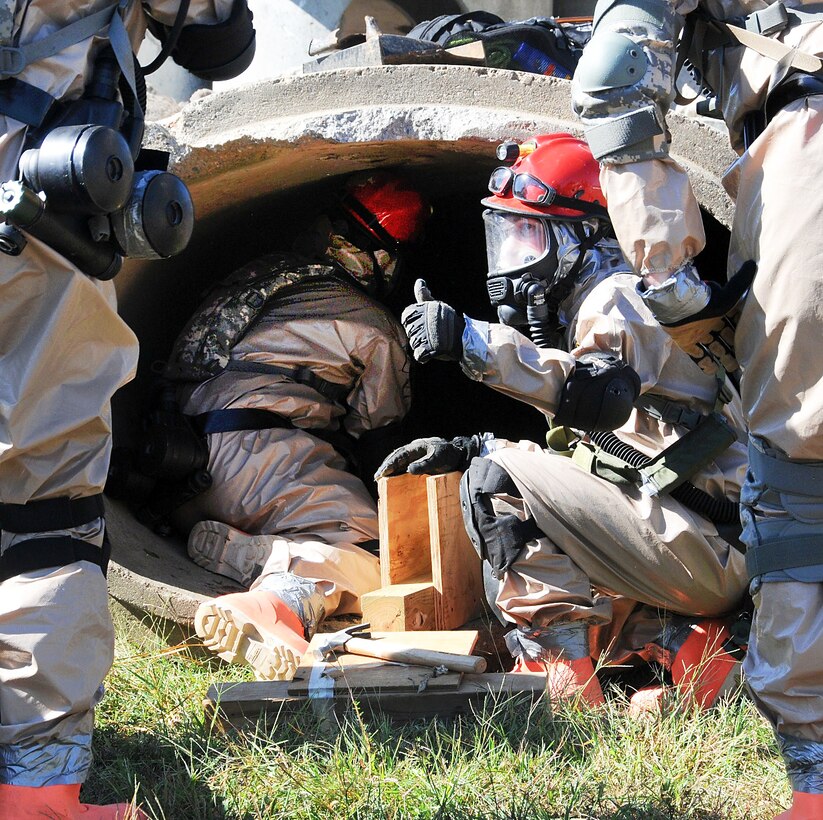 Soldiers search through rubble for mock casualties of a simulated ...