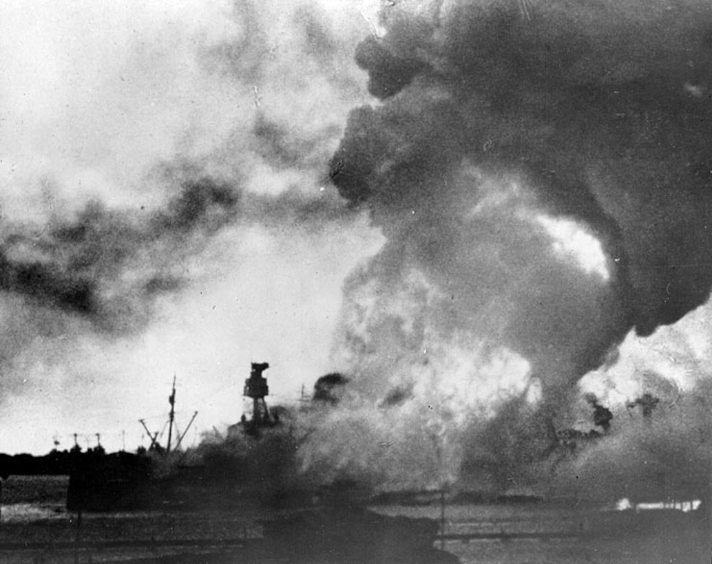 The USS Arizona burns after being struck by a Japanese armor-piercing ...
