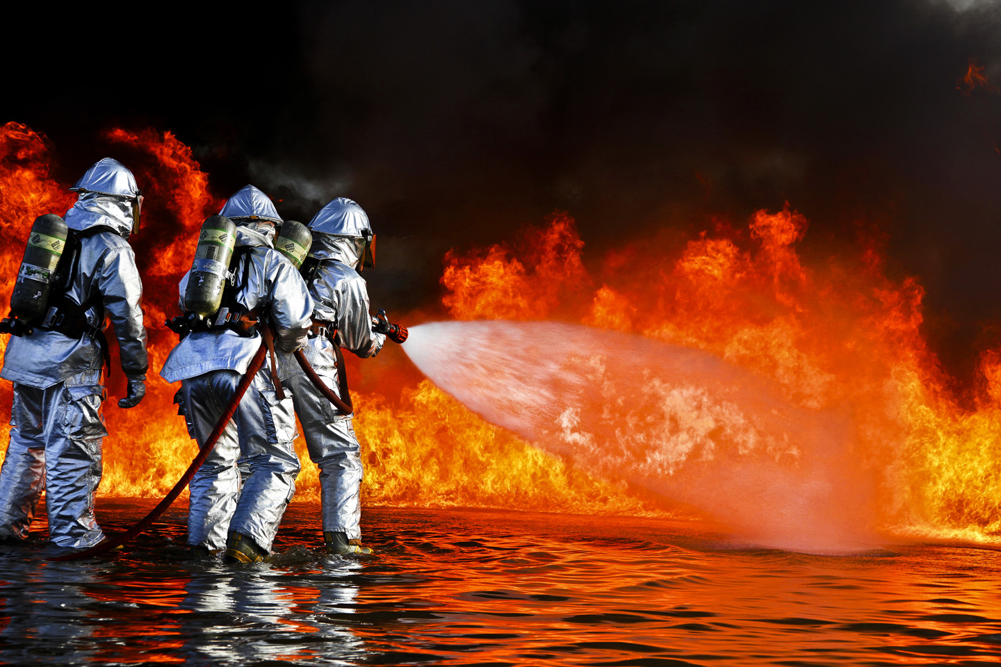 Marines battle a huge blaze during a pit fuel fire training exercise at ...