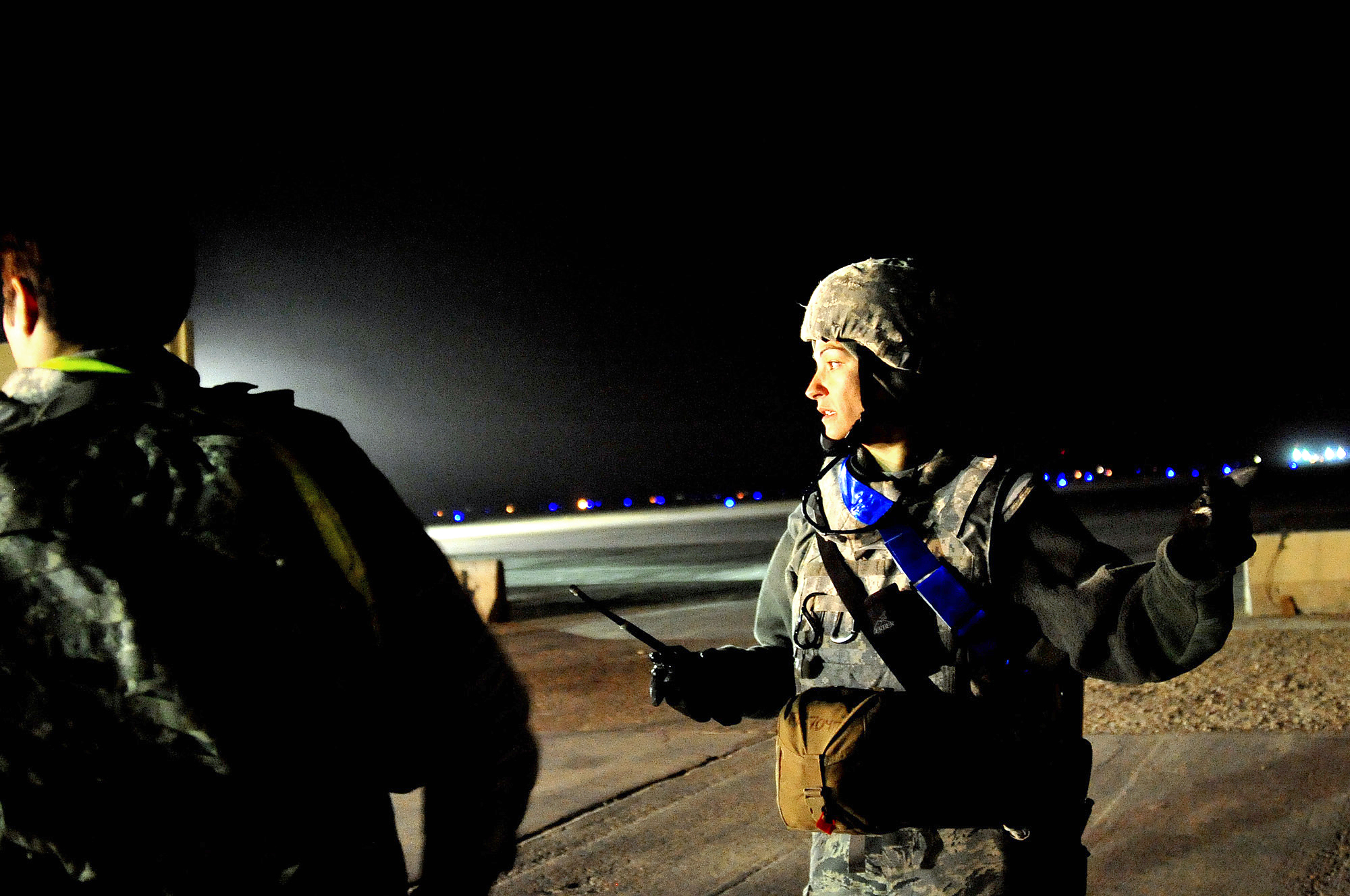U.S. Air Force Master Sgt. Jessica Coombs coordinates the movement of ...