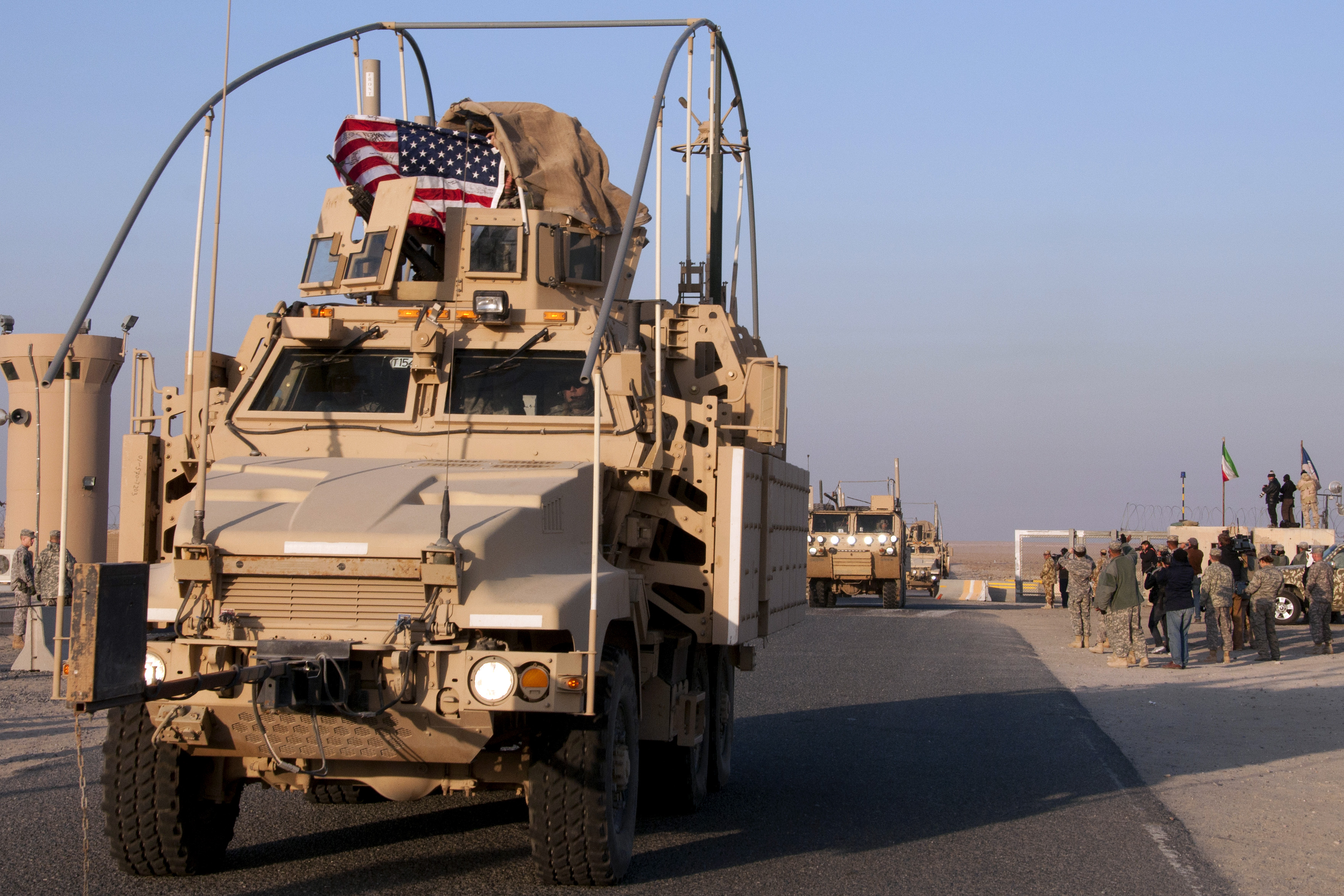A U.S. flag flies from a mine-resistant, ambush-protected vehicle as it ...