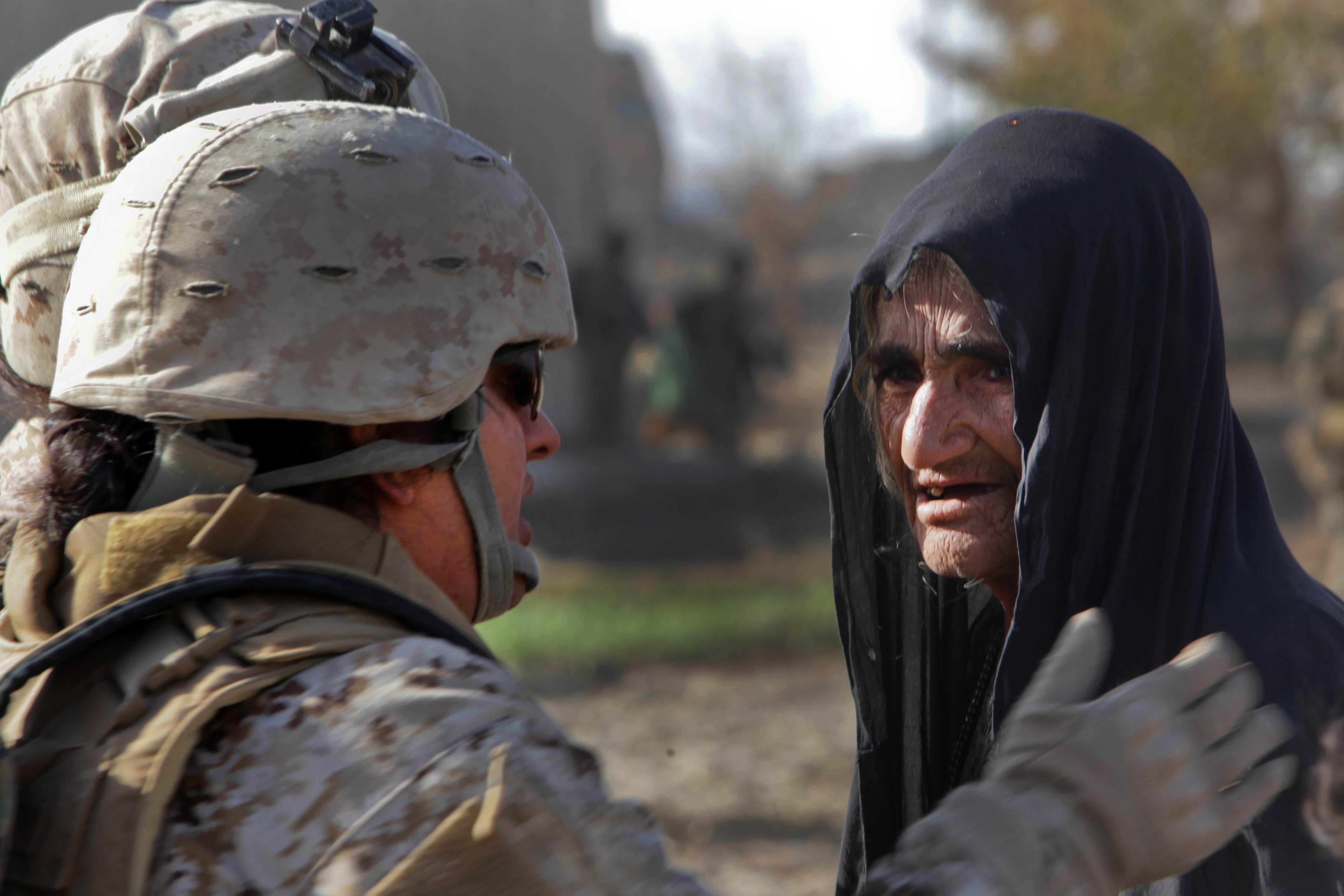 U.S. Navy Petty Officer 2nd Class Kimberly Ryan, rear, talks with Janet ...
