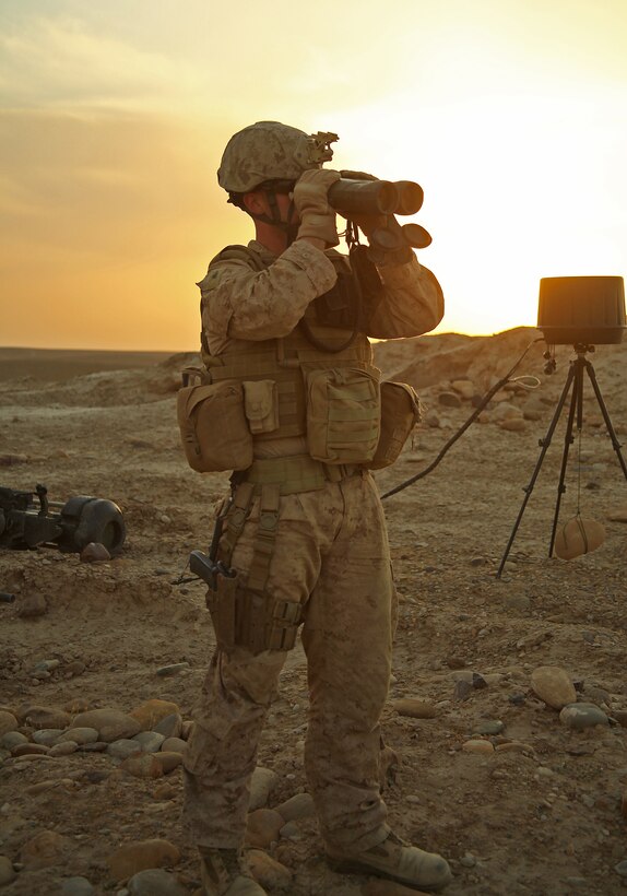 Cpl. Lucas Boyle scans the terrain in front of him