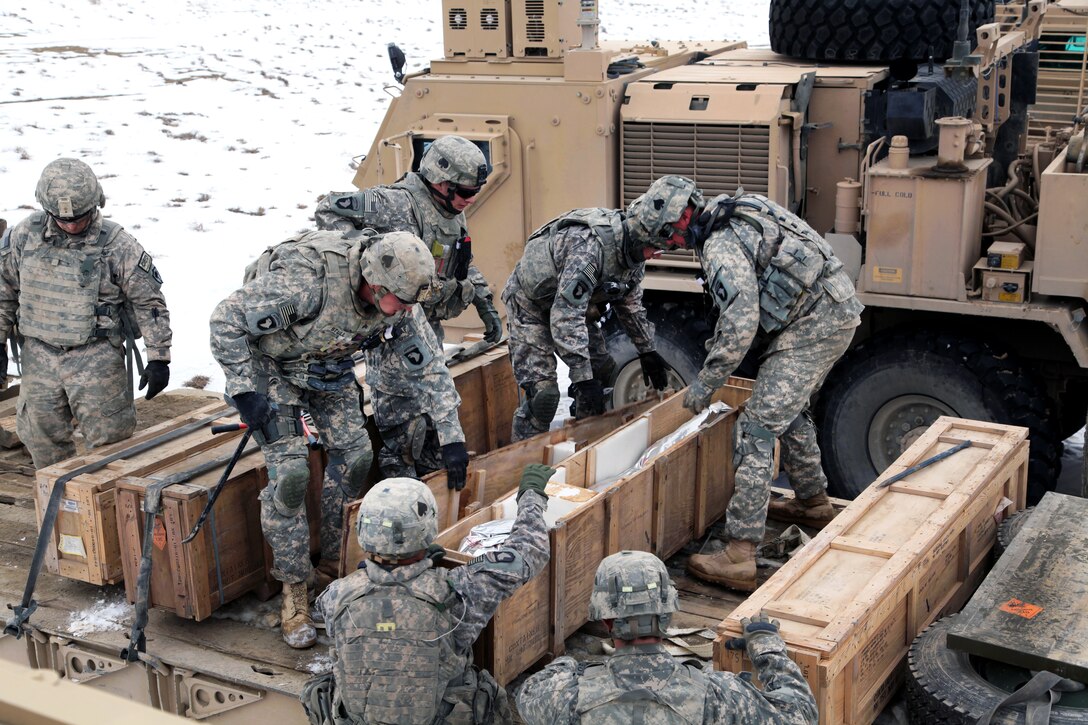 U.S. Army soldiers unload a tow rocket near route Dodge in Paktika ...