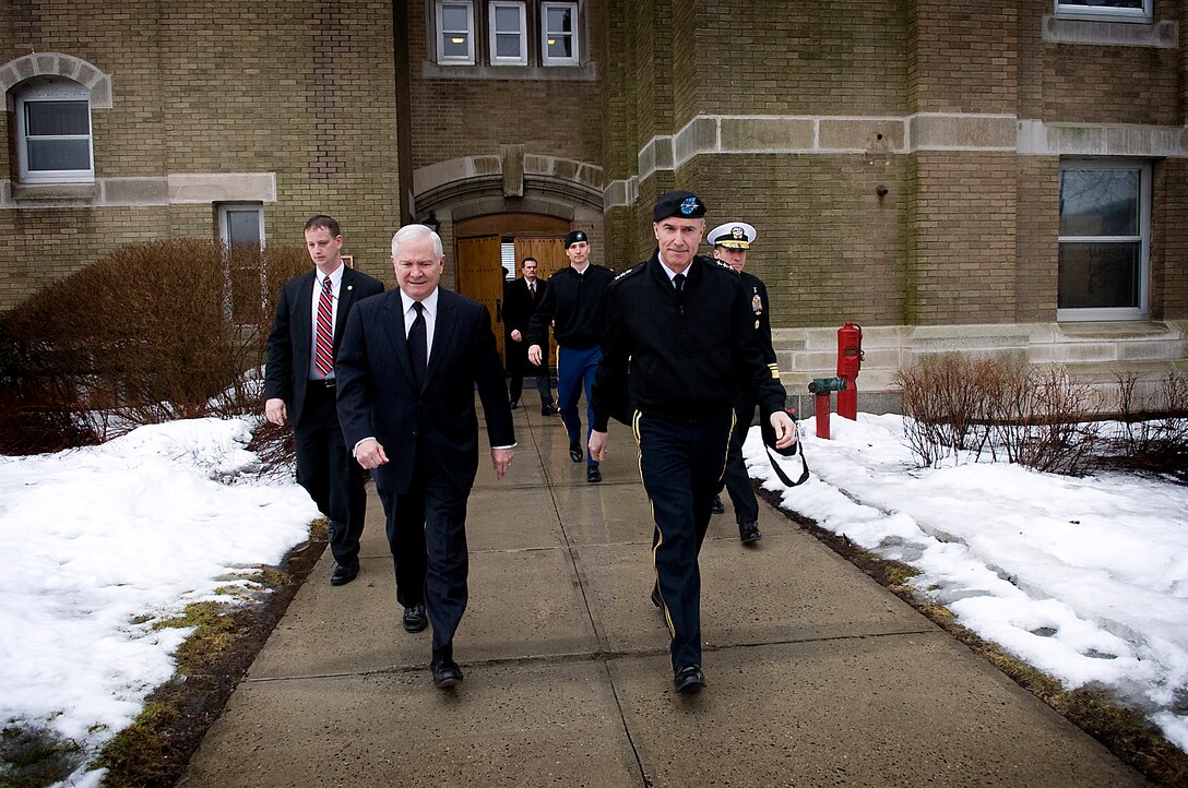 Defense Secretary Robert M. Gates walks with Army Lt. Gen. David ...