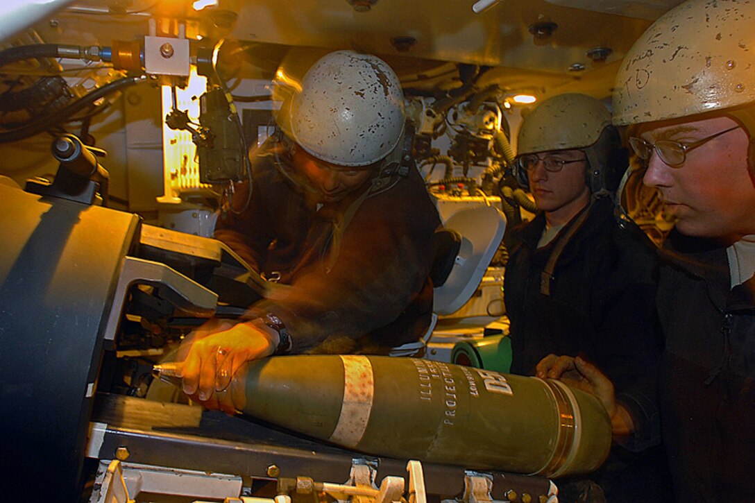 Army Staff Sgt. Freddy Perdue confirms a 155 mm illumination round as ...