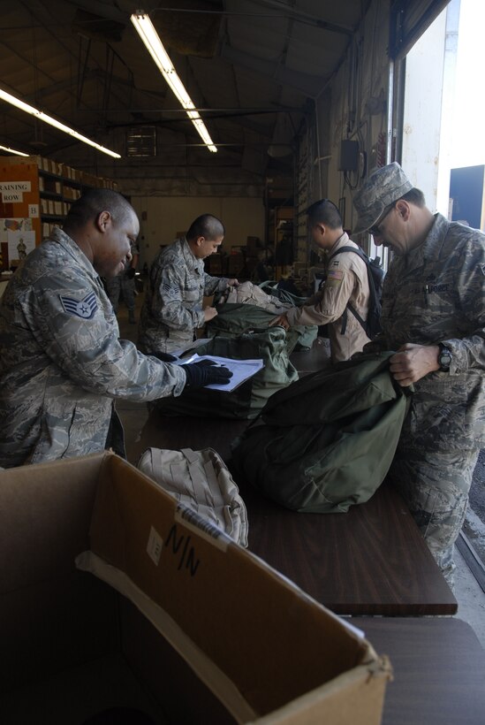 129th Logistics Readiness Squadron members assist redeploying Airmen