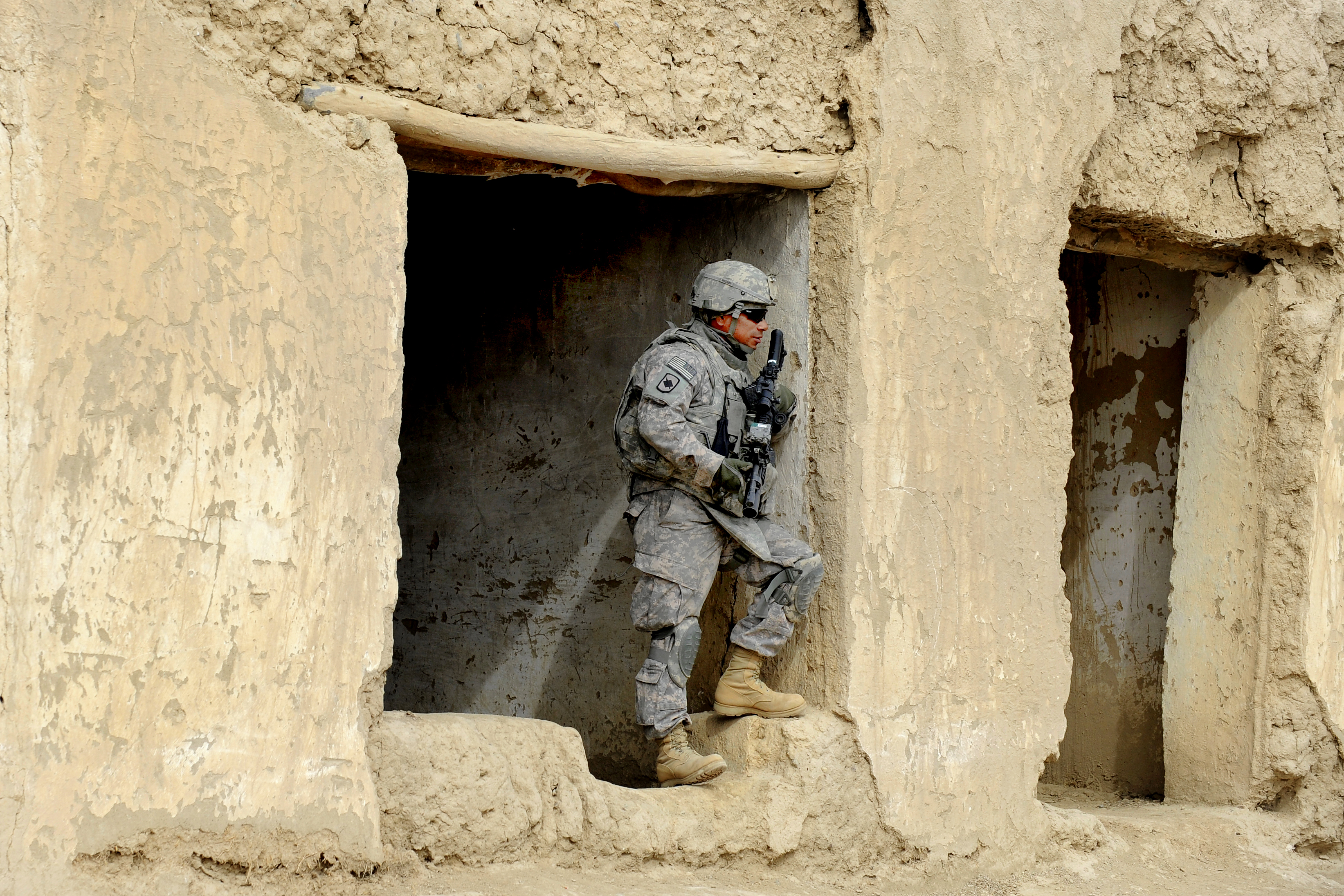 U.S. Army Sgt. Johnny Hoyos pulls security during a trip to the Shahr-e ...