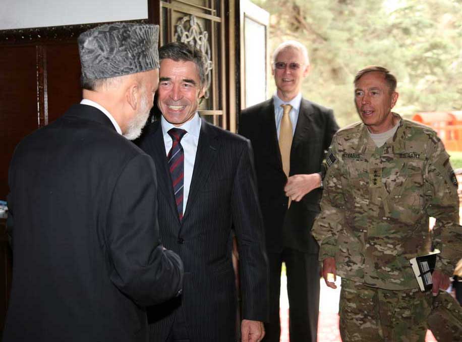 Afghan President Hamid Karzai, left, greets NATO Secretary General ...