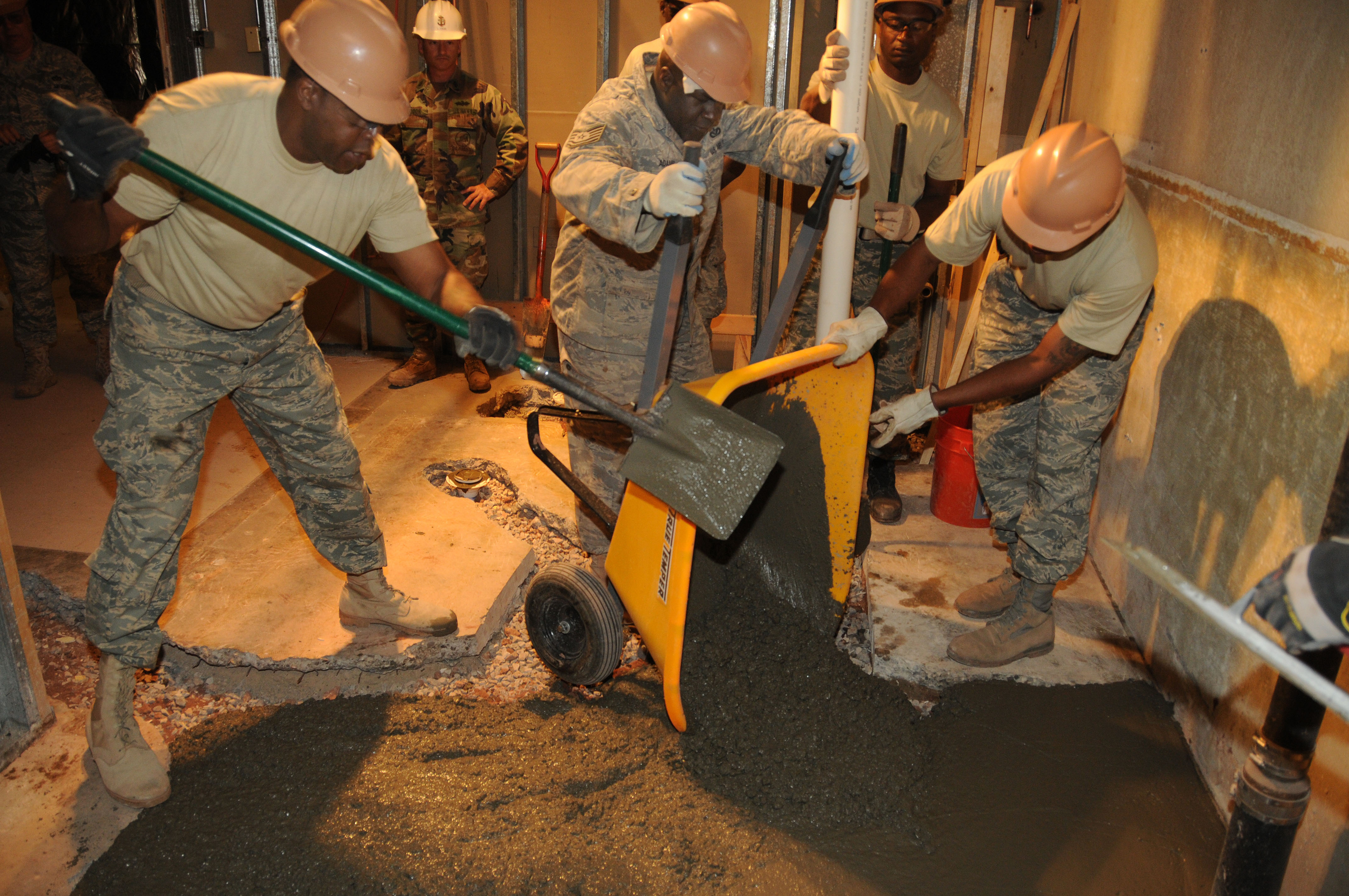 113th Civil Engineer Squadron members pour cement during rehabilitation ...