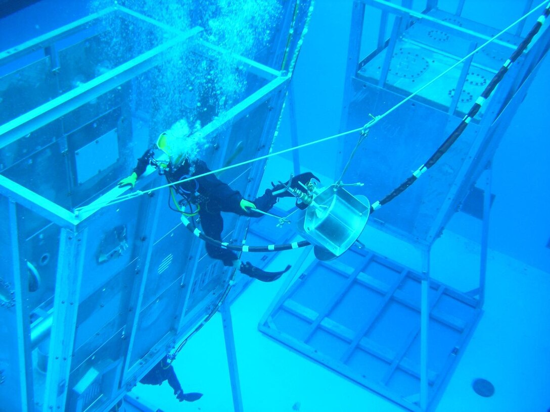 A student at Navy Dive School in Panama City, Fla., makes one of the ...