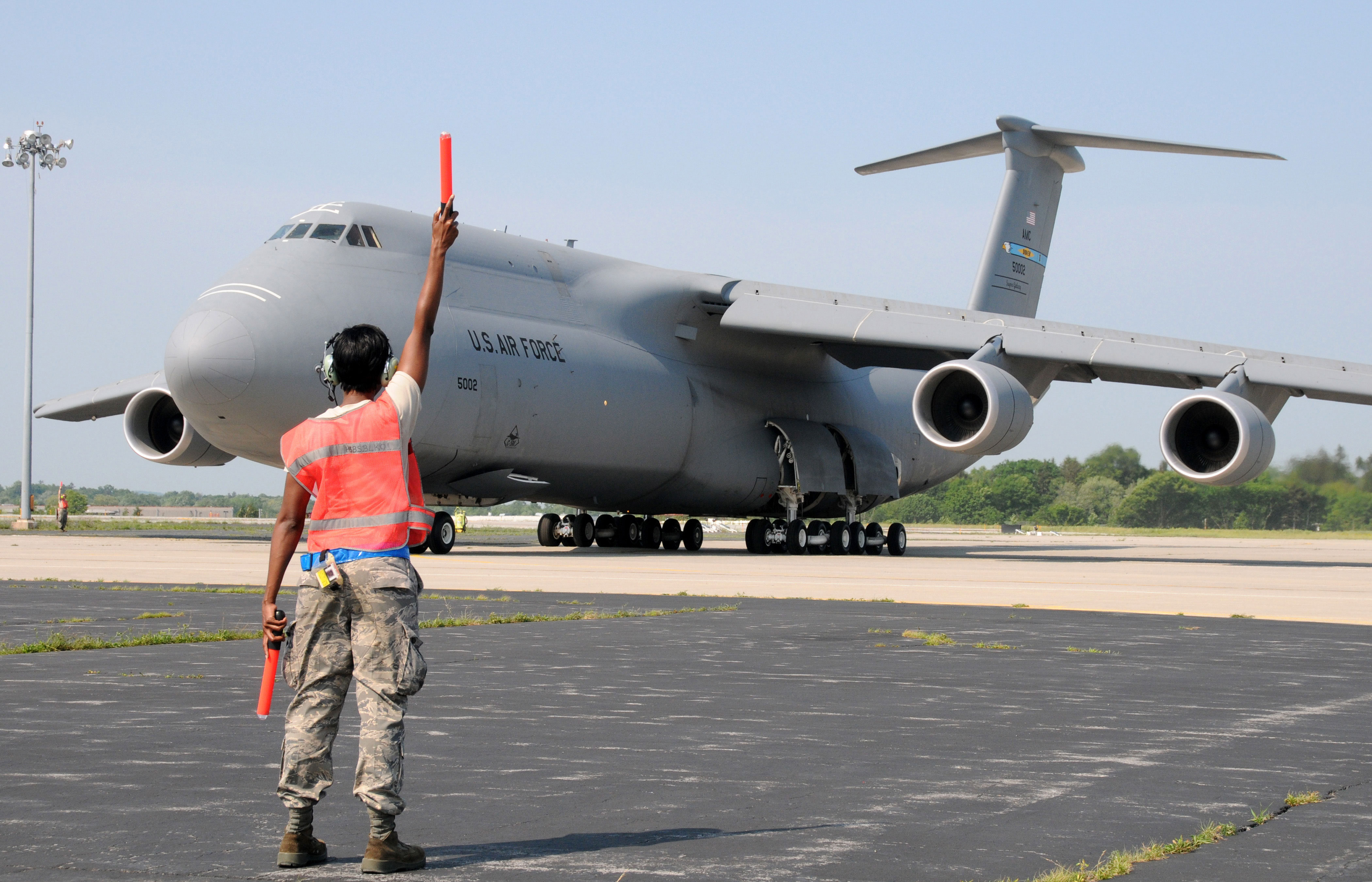 The second C-5M Super Galaxy reconditioned by 105AW marshaled toward ...