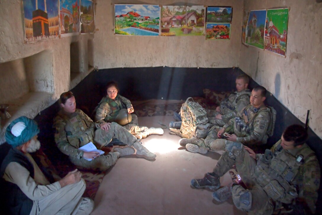 U.S. Army soldiers talk with a local elder during a mission to patrol ...
