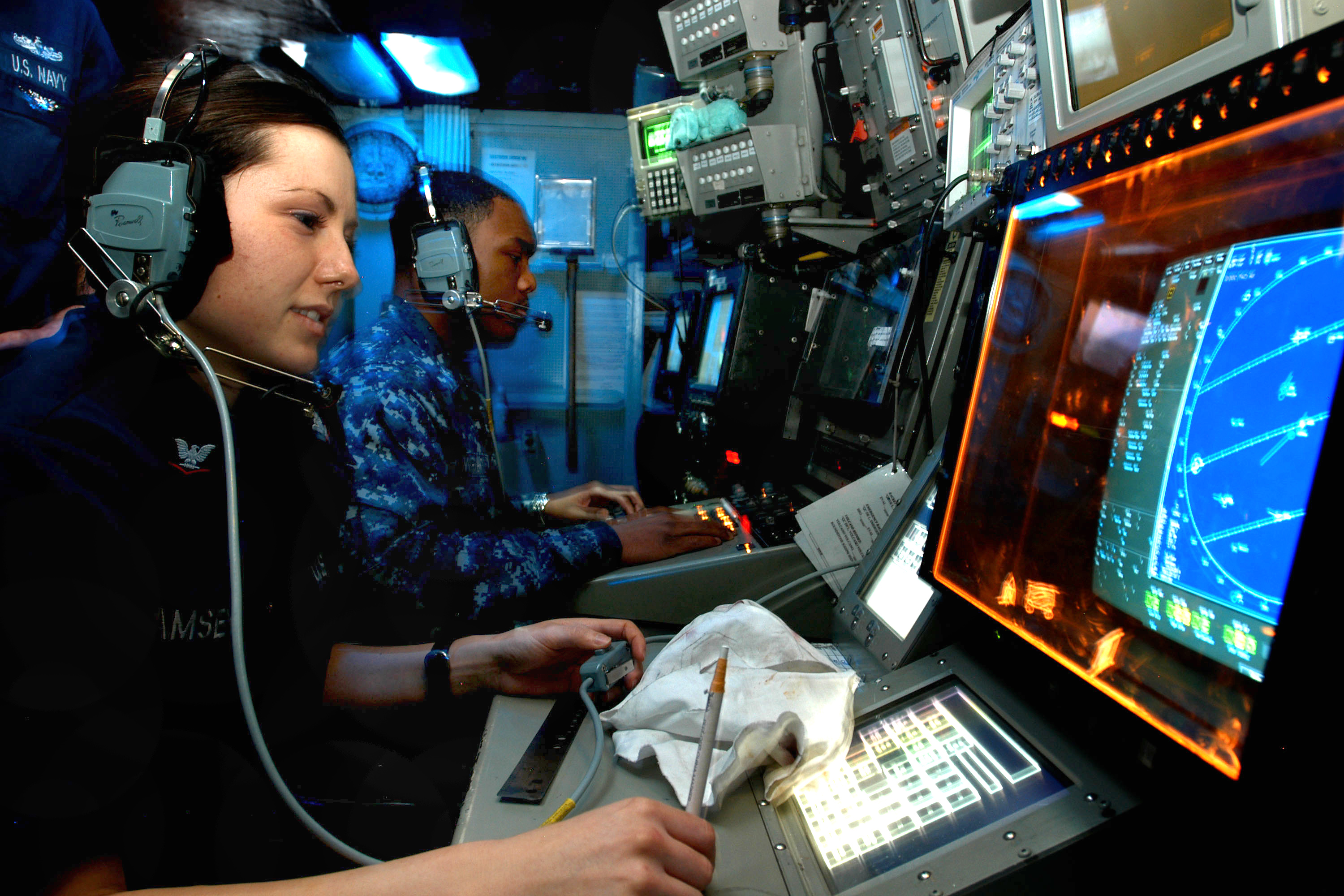 U.S. Navy Petty Officer 3rd Shayna Ramsey monitors a radar in the ...