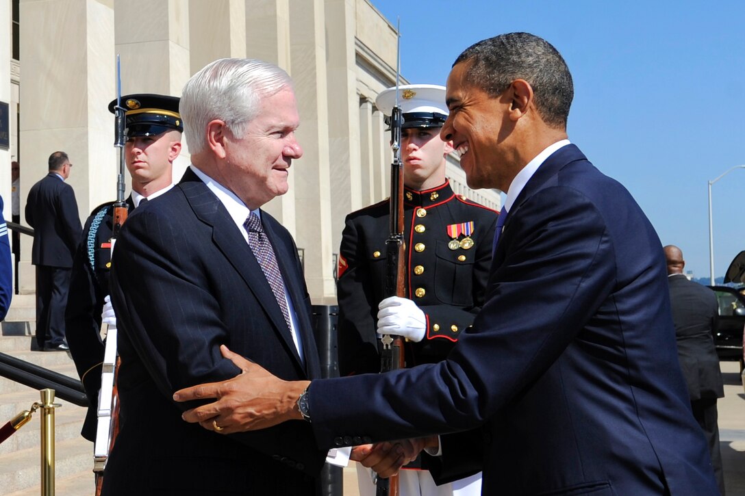 Defense Secretary Robert M. Gates greets President Barack Obama upon ...