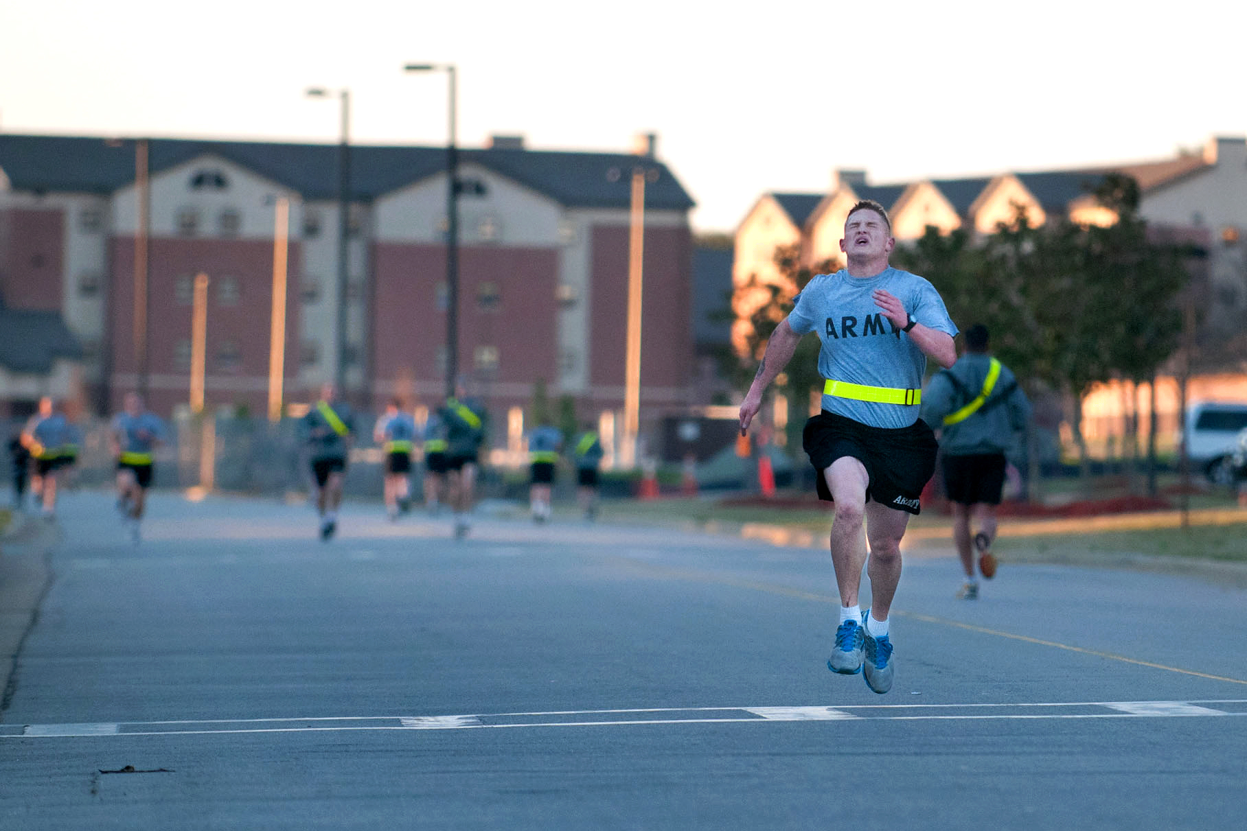U.S. Army Spc. Jordan Tackett crosses the finish line of the two-mile ...