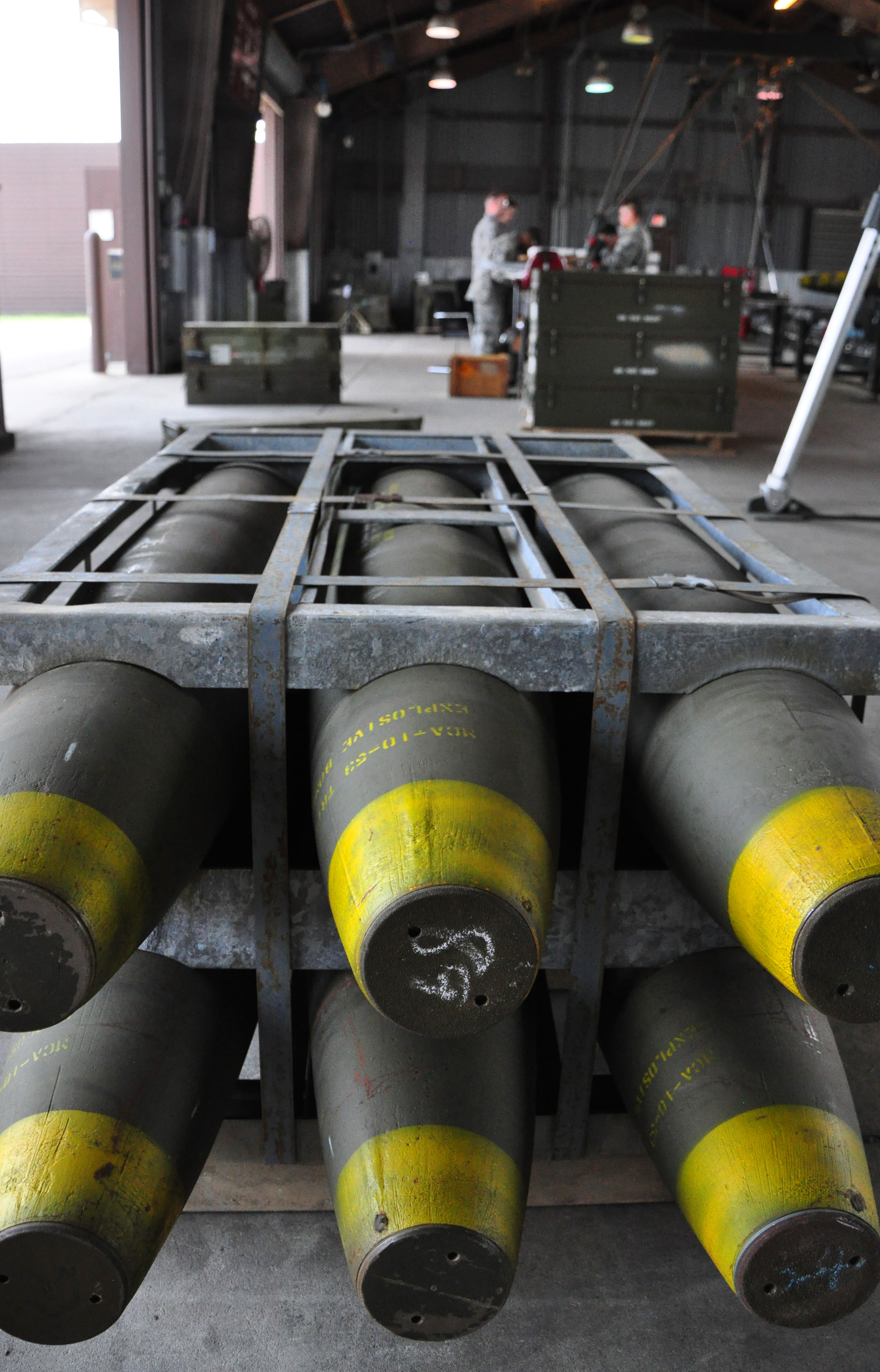 Bombs away: Airmen work together to build, load munitions