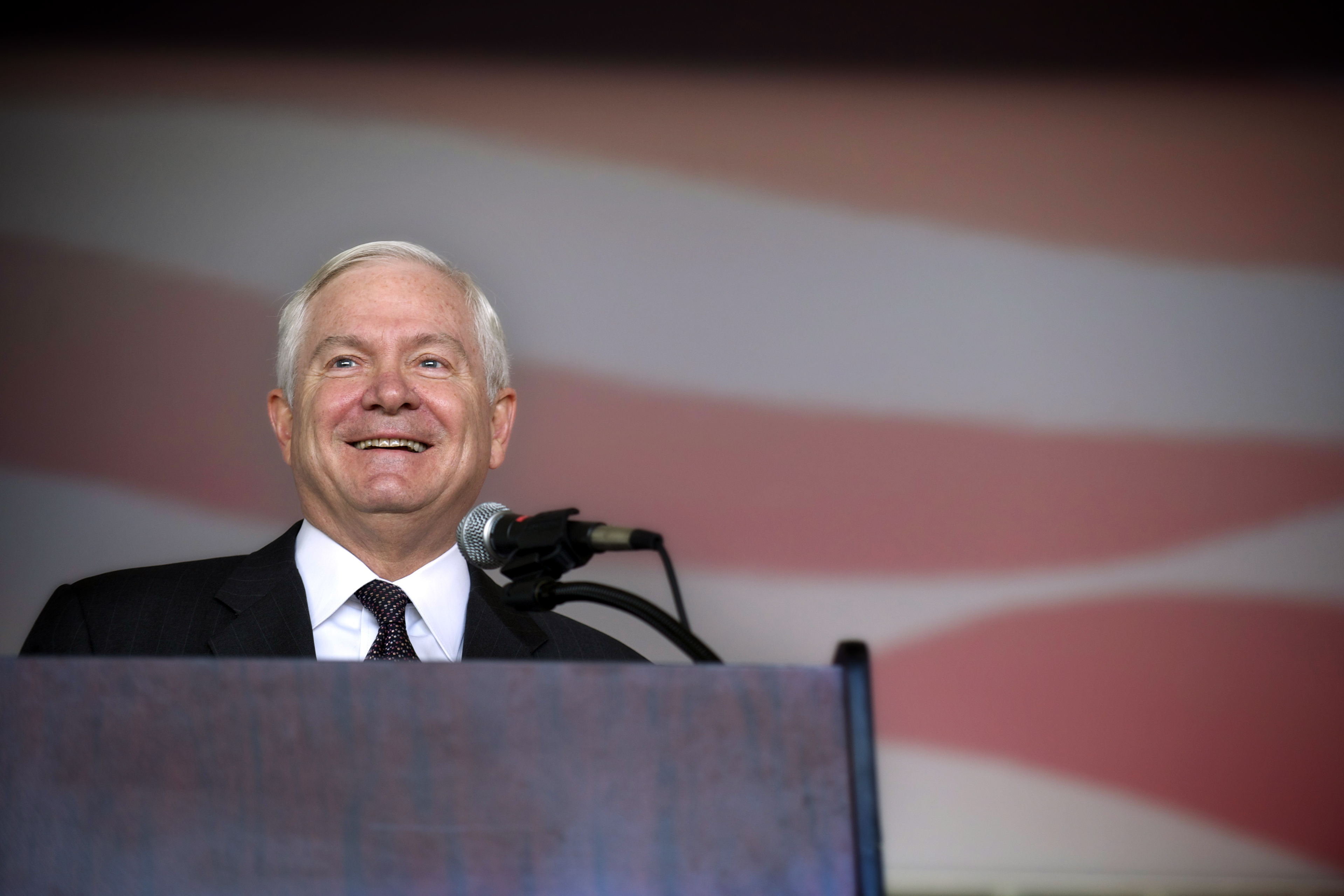 Defense Secretary Robert M. Gates smiles while speaking to airmen of ...