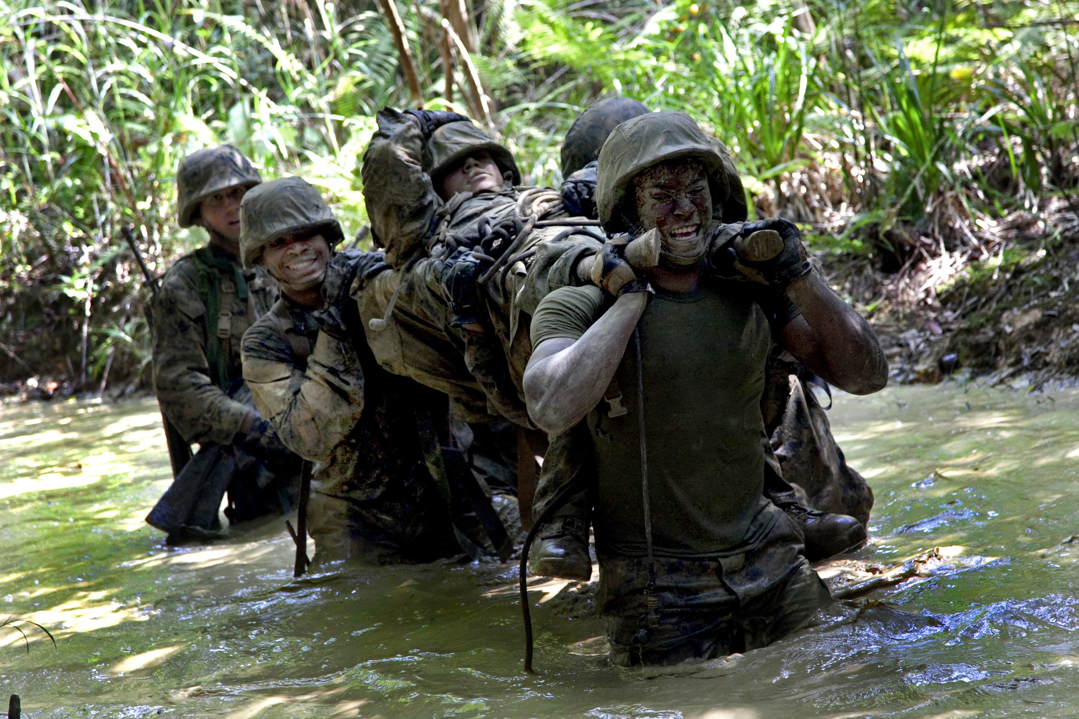 U.S. Marines carry an exercise participant simulating fatal injury ...