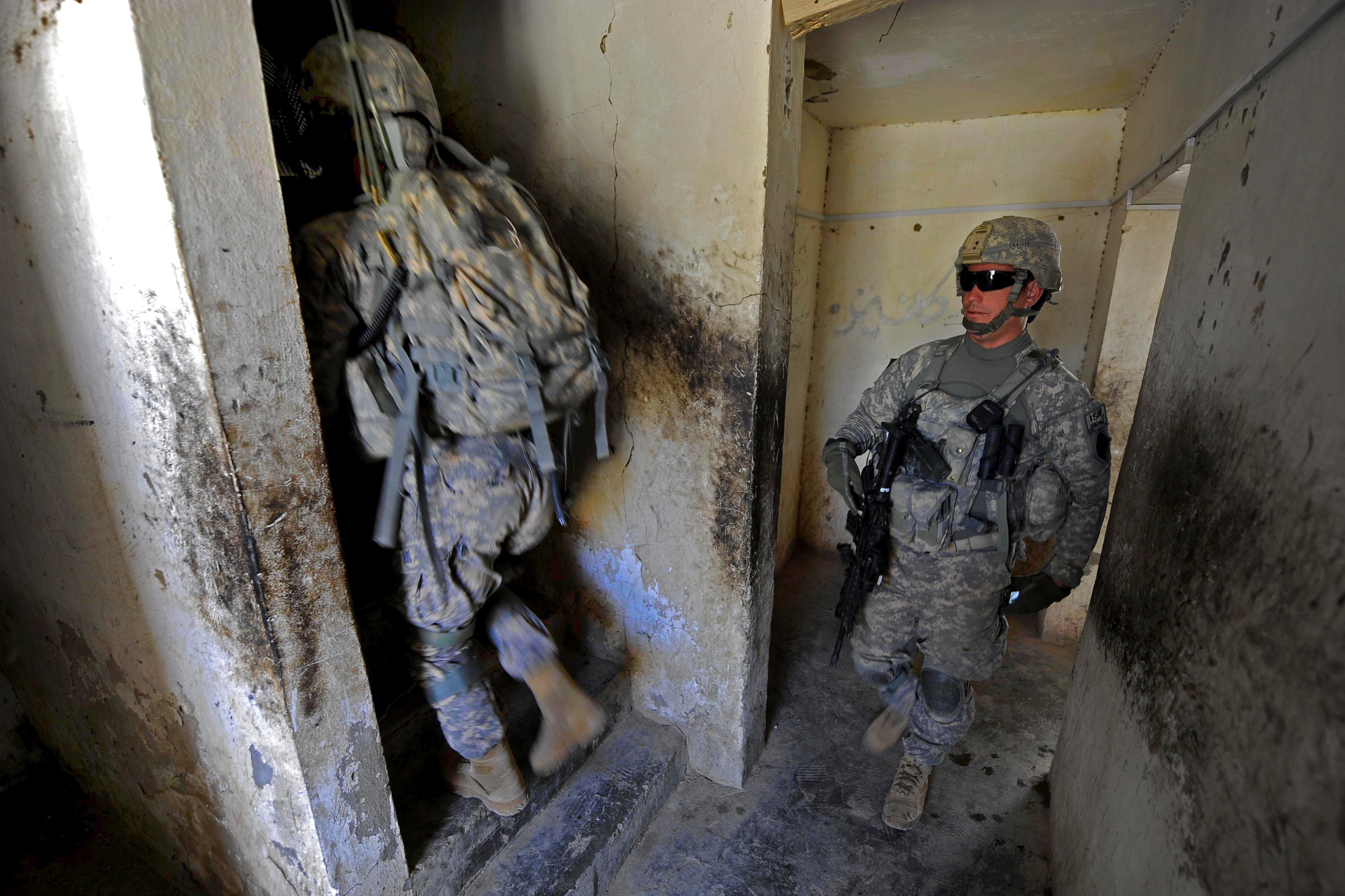 U.S. Army Spc. Daniel Scott, left, and Sgt. 1st Class Jeffrey Cesaitis ...