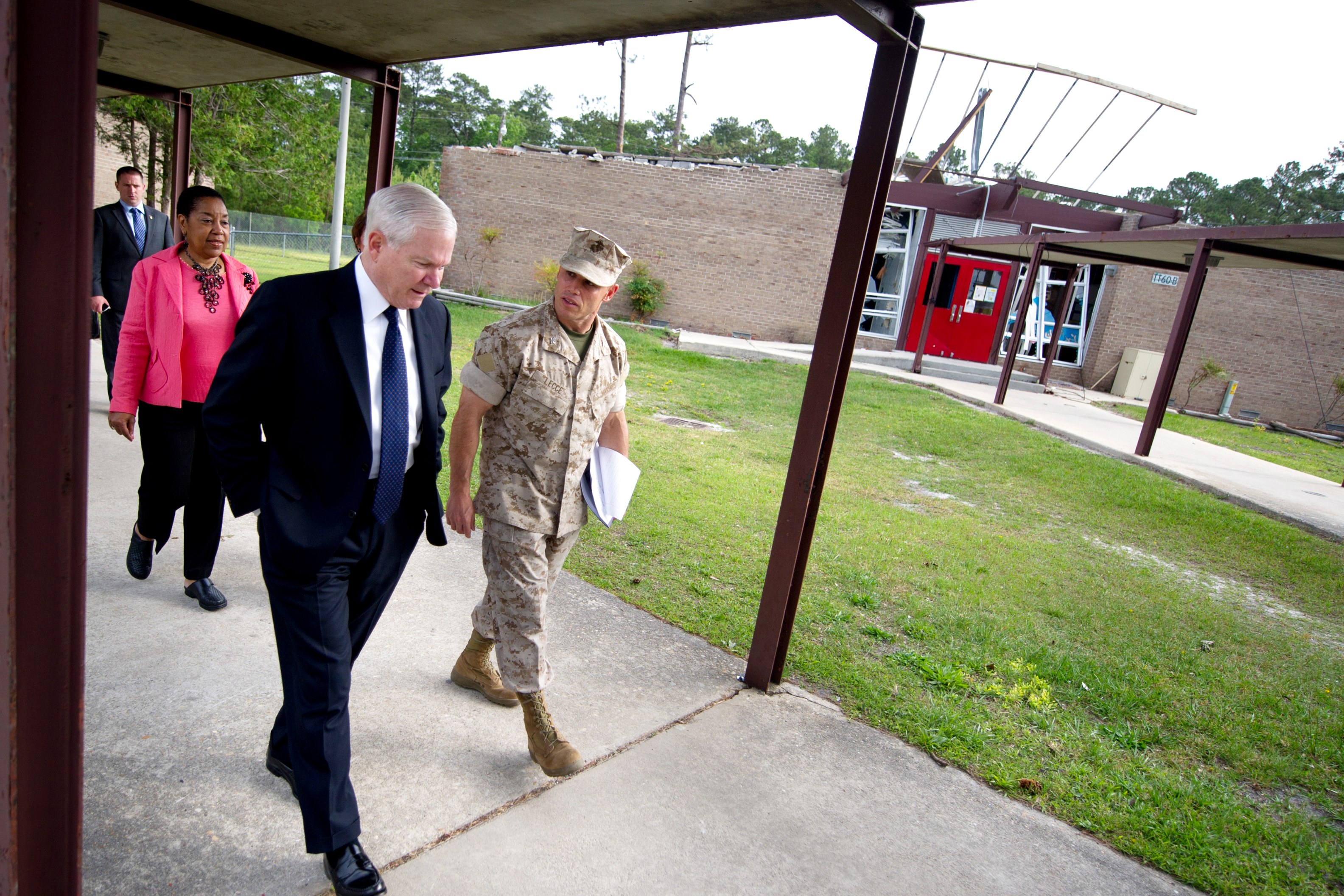 U.S. Marine Col. Daniel Lecce, base commander, briefs Defense Secretary ...