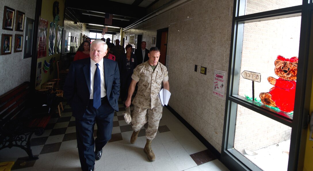 U.S. Marine Col. Daniel Lecce, base commander, briefs Defense Secretary ...