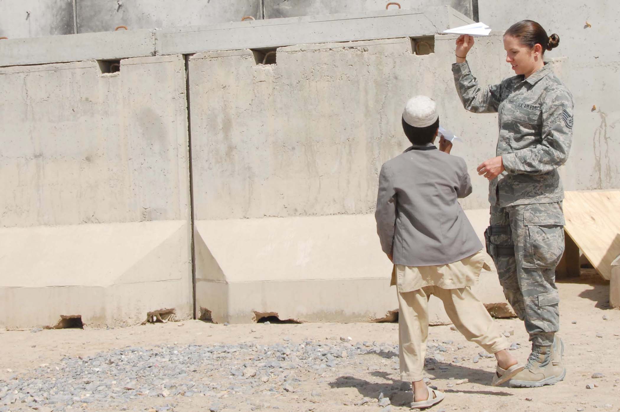 Airmen build paper airplanes, relationships > Air Force > Features