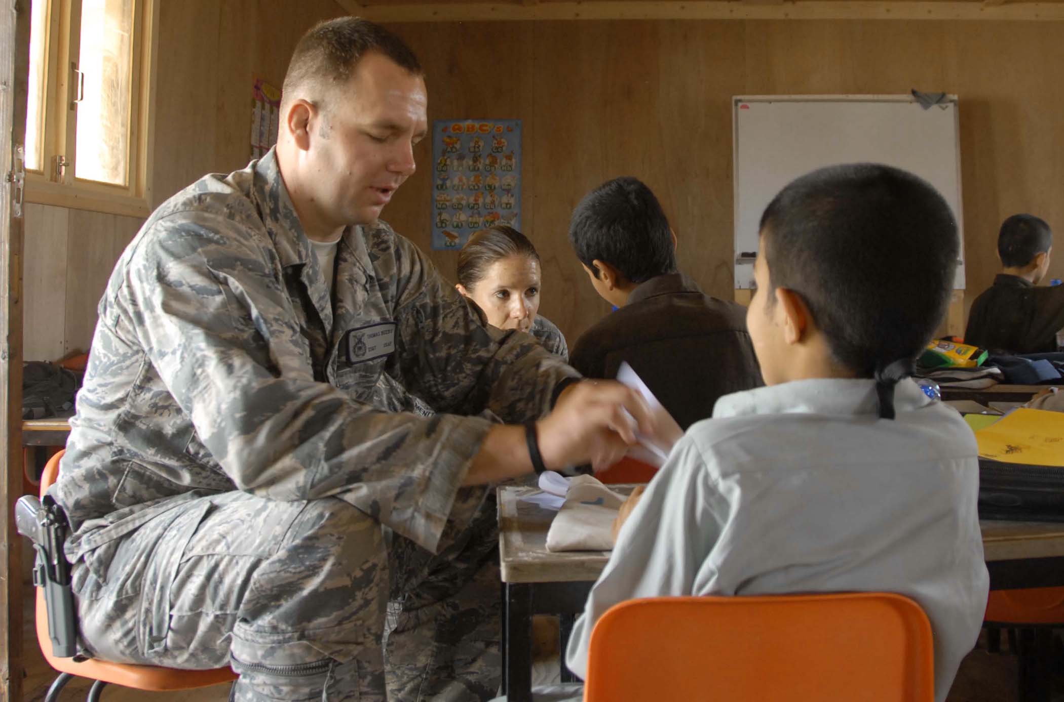 Airmen build paper airplanes, relationships > Air Force > Features